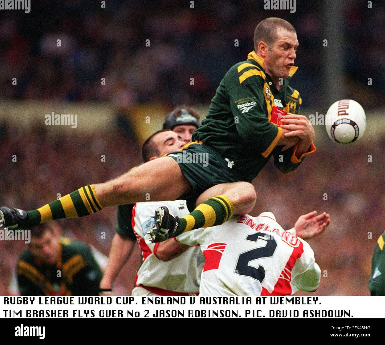 Tim Brasher Australian flys over Jason Robinson English Player Stock ...