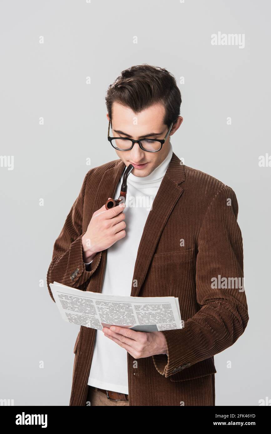 Man smoking pipe reading newspaper hi-res stock photography and images ...