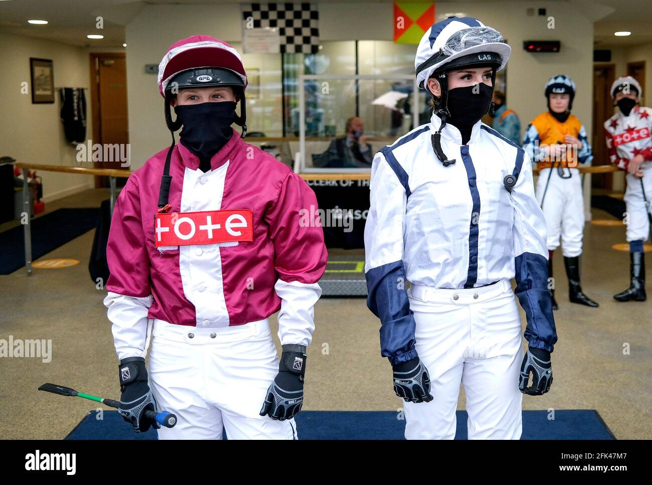 Jockeys Ellie Mackenzie (left) and Grace McEntee wait in the weighing ...