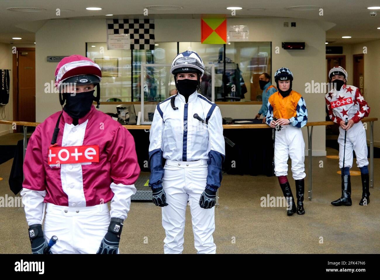 Jockeys Ellie Mackenzie (left) and Grace McEntee wait in the weighing ...