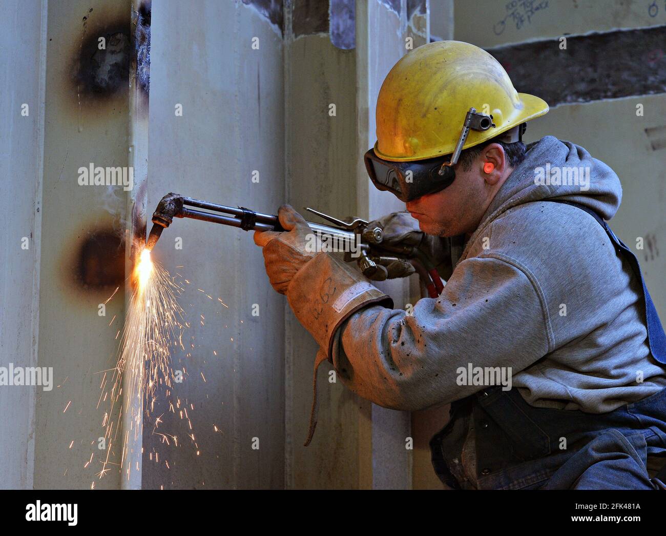 shipyard worker with welding torch Stock Photo - Alamy