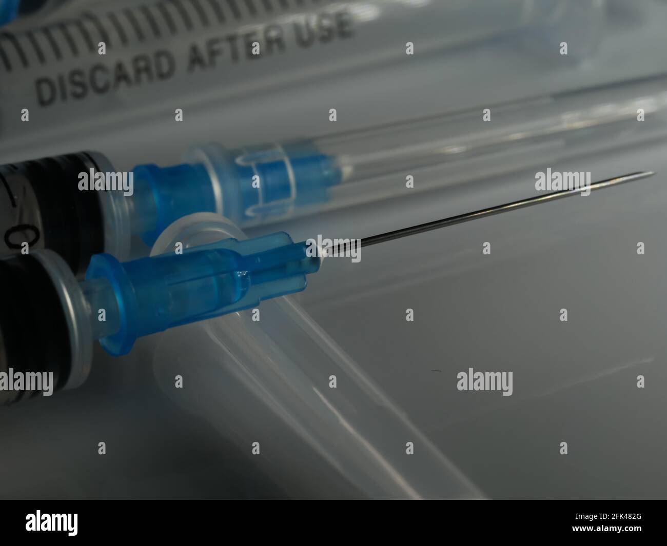 Several syringe on white table prepared for injection in hospital ...
