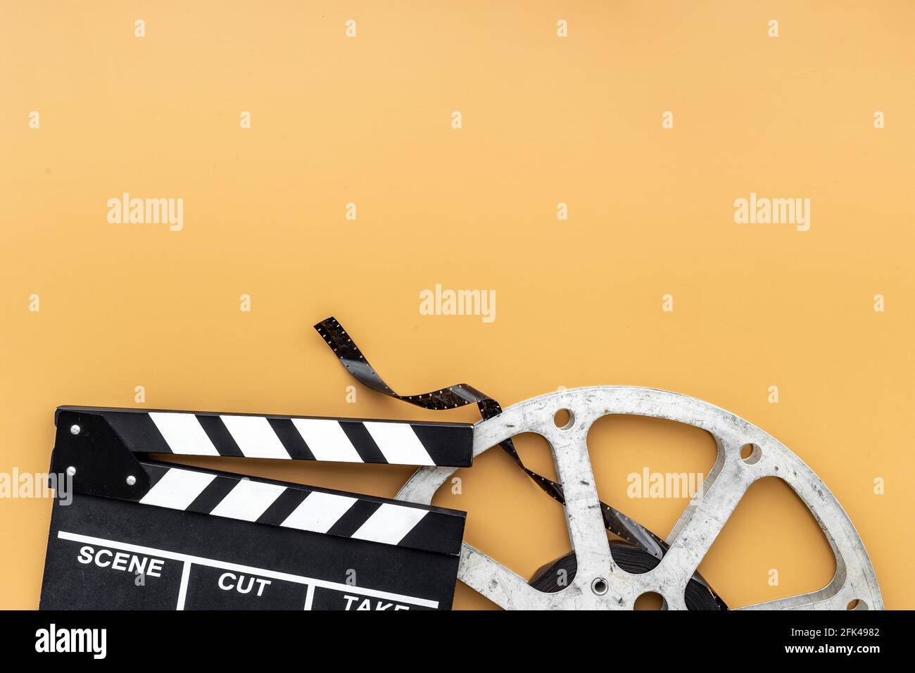 Motion picture film reel with movie clapper. Cinema concept Stock Photo ...