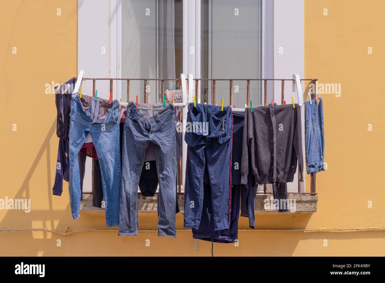 Linen is dried in a narrow street of Italy Stock Photo - Alamy