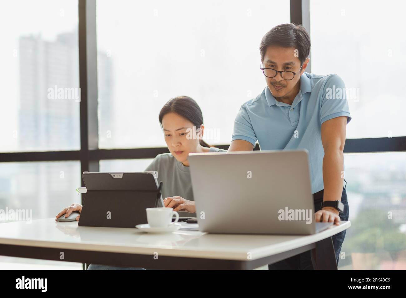 Business teamwork man and woman working on their computer Stock Photo ...