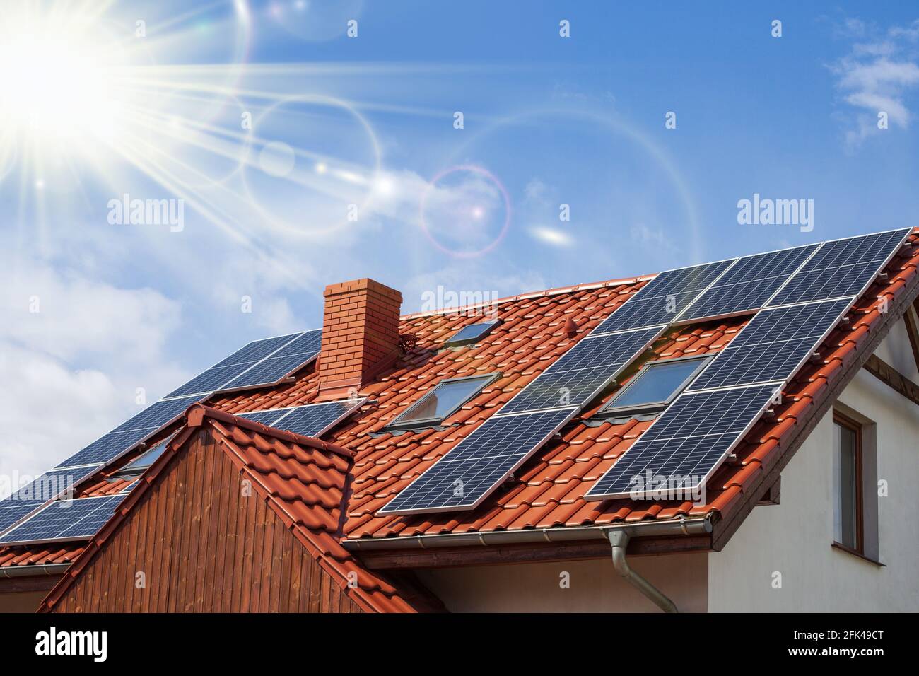 House with solar panel - blue sky and SUNLIGHT Stock Photo - Alamy