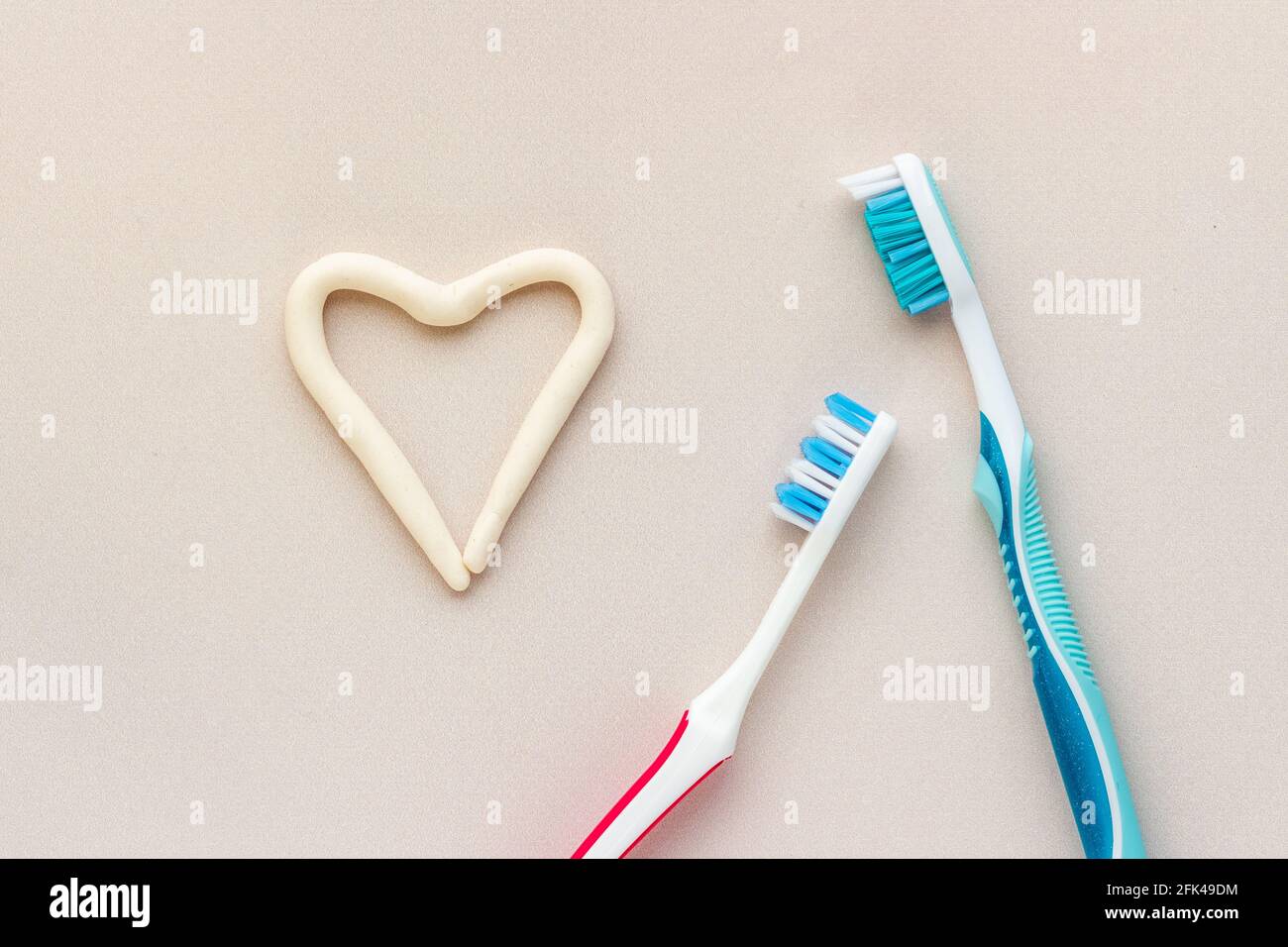 Heart shape of toothpaste with toothbrush, top view. Oral care and ...