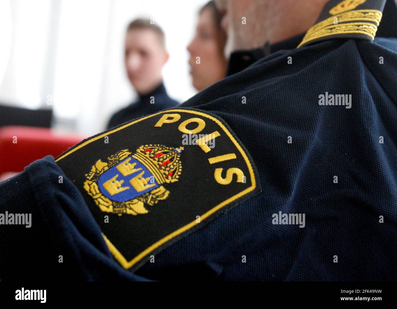 Police officers at a police station Stock Photo - Alamy