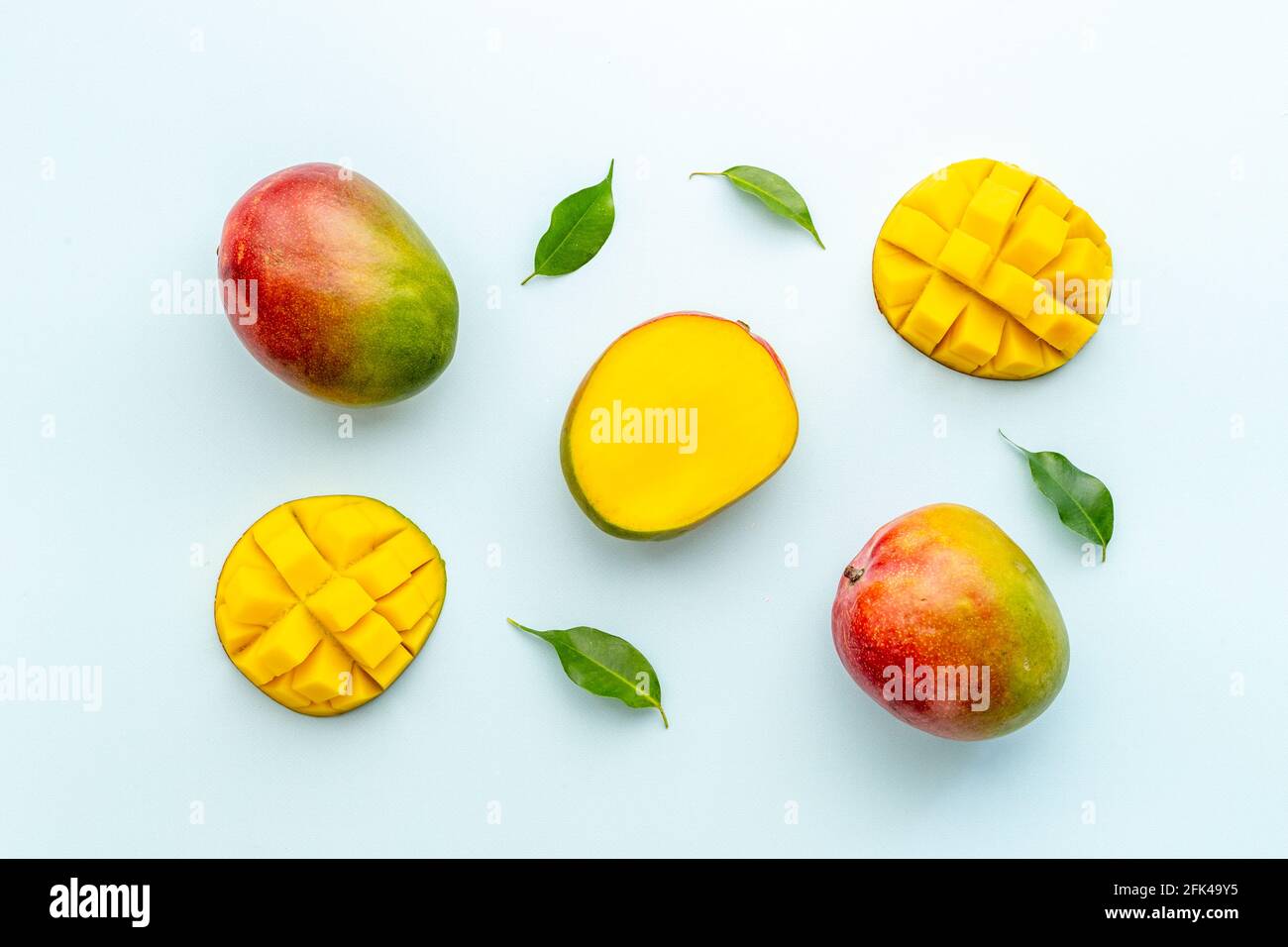 Mango layout - tropical fruits abstract background Stock Photo - Alamy