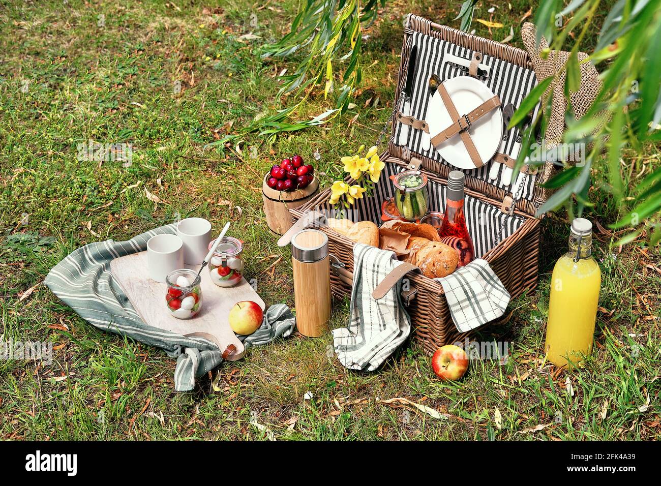 Zero waste picnic al fresco. Vintage picnic basket, hamper with ...