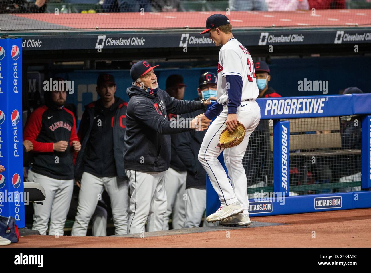 Cleveland Indians pitcher Zach Plesac is congratulated by Cleveland Indians pitching coach Carl ...