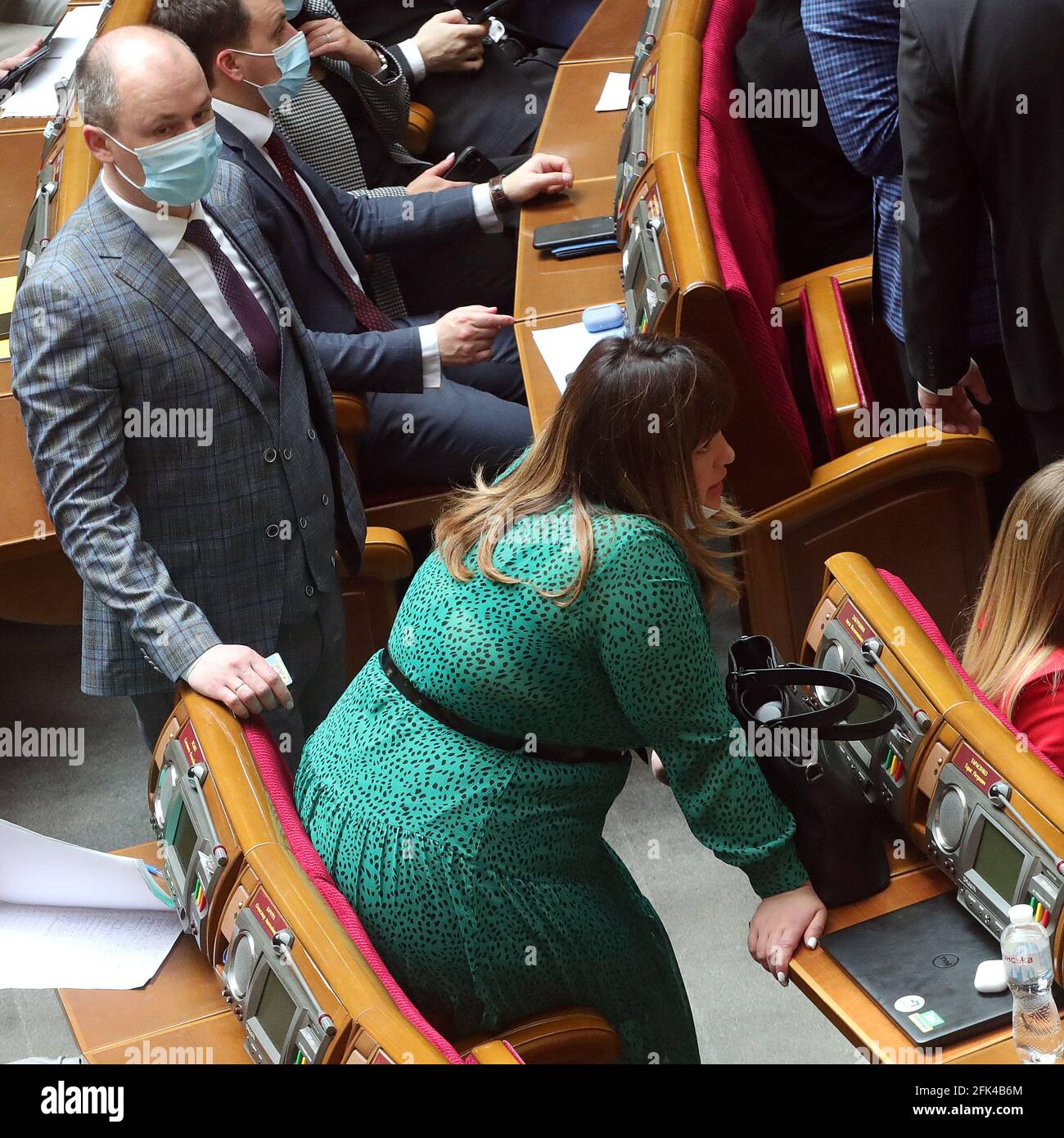 KYIV, UKRAINE - APRIL 28, 2021 - MPs are gathered around the rostrum ...
