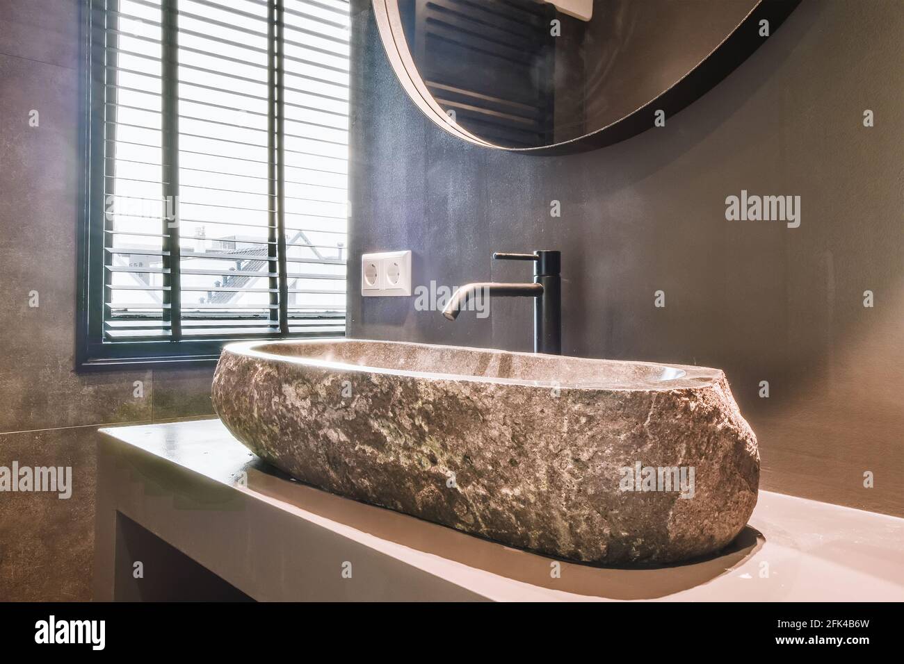 Modern stone vessel sink in bathroom Stock Photo - Alamy