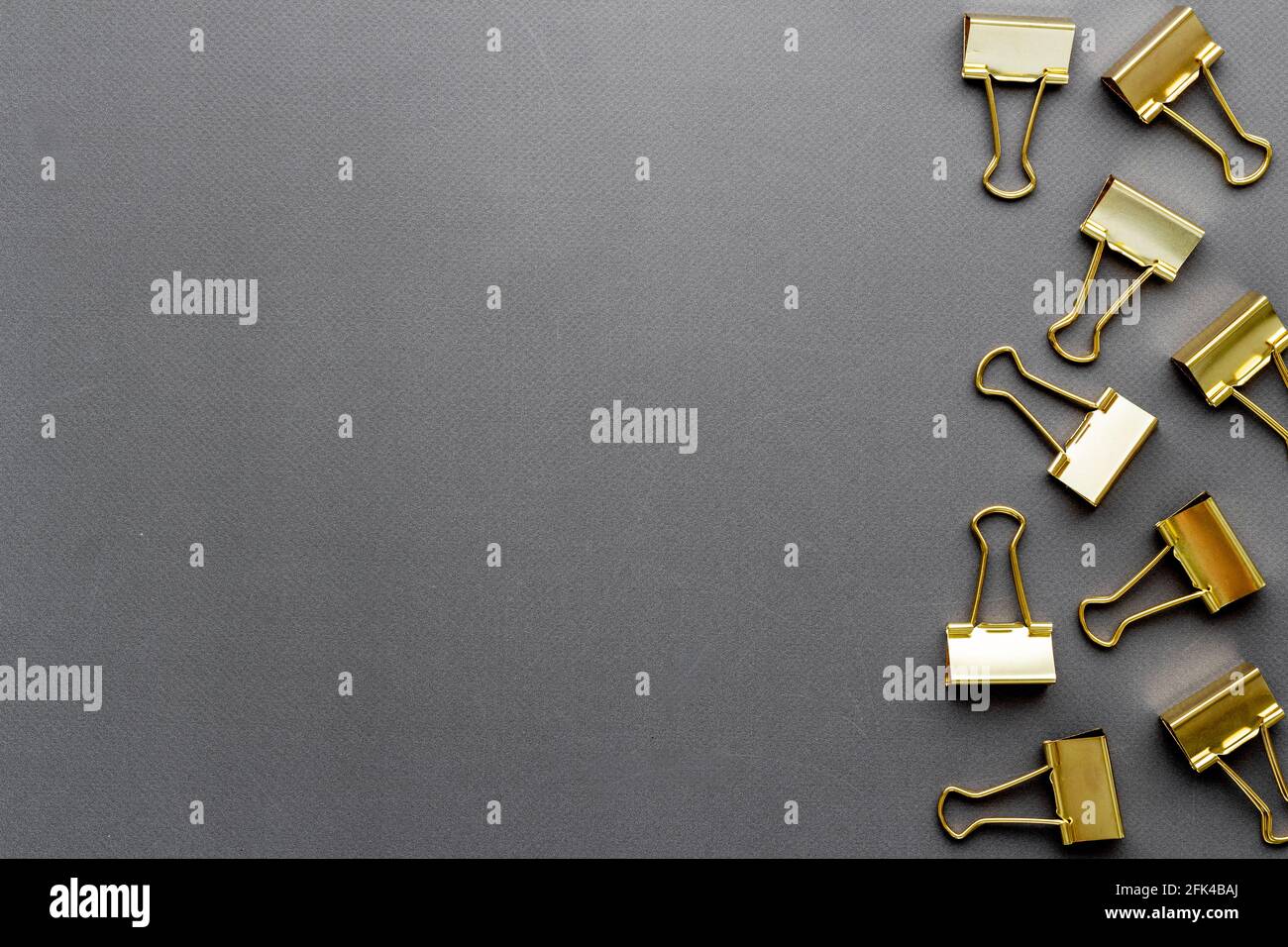 Office supplies background - paper binder clips top view Stock Photo ...