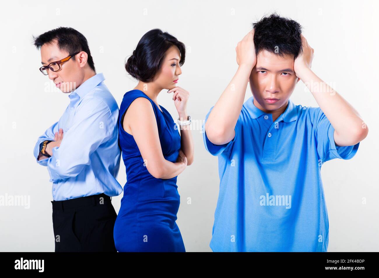 Young Chinese boy suffering from fighting parents and their divorce ...