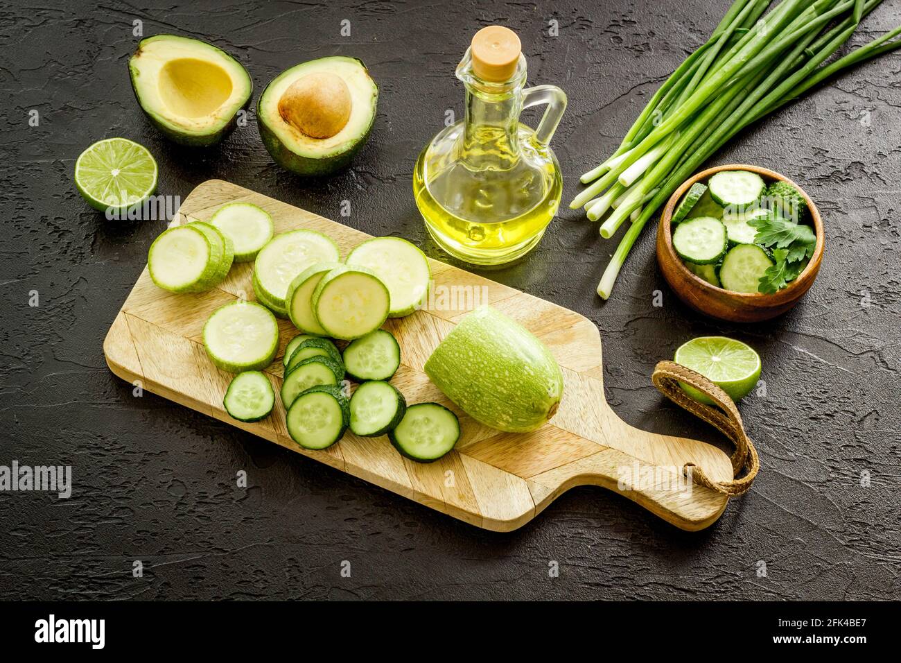 Cooking fresh salad with green vegetables. Raw food diet Stock Photo ...