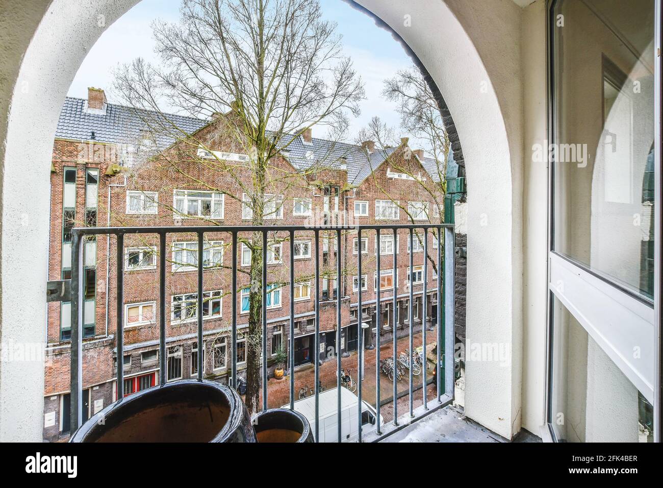 Open window viewing street with residential brick house Stock Photo - Alamy