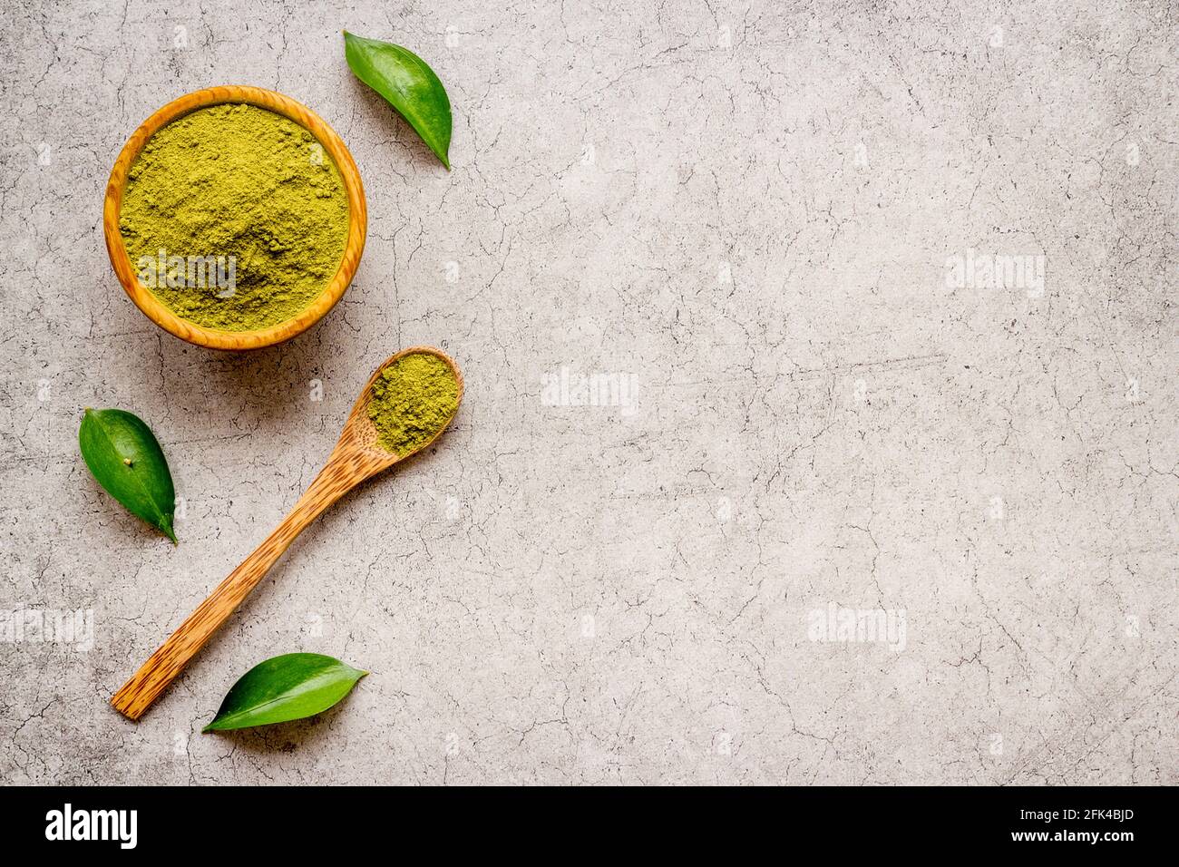 Raw matcha tea powder in wooden bowl. Natural healthy drink Stock Photo ...