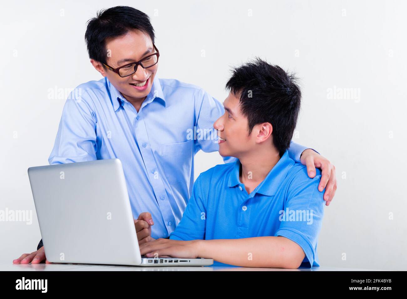 Chinese father helps his son with knowledge and experience for his ...