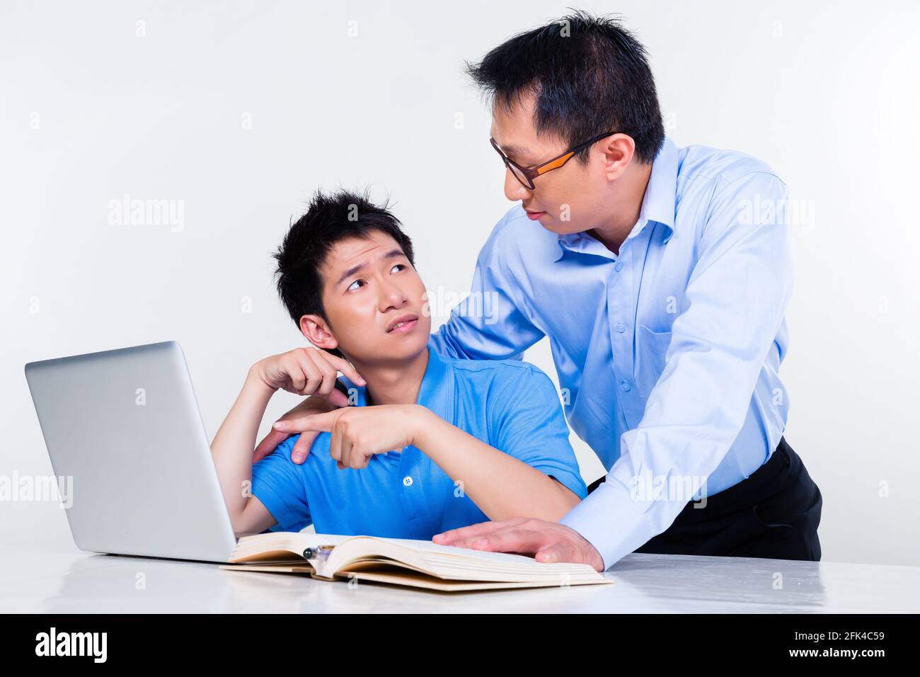 Chinese father helps his son with knowledge and experience for his ...