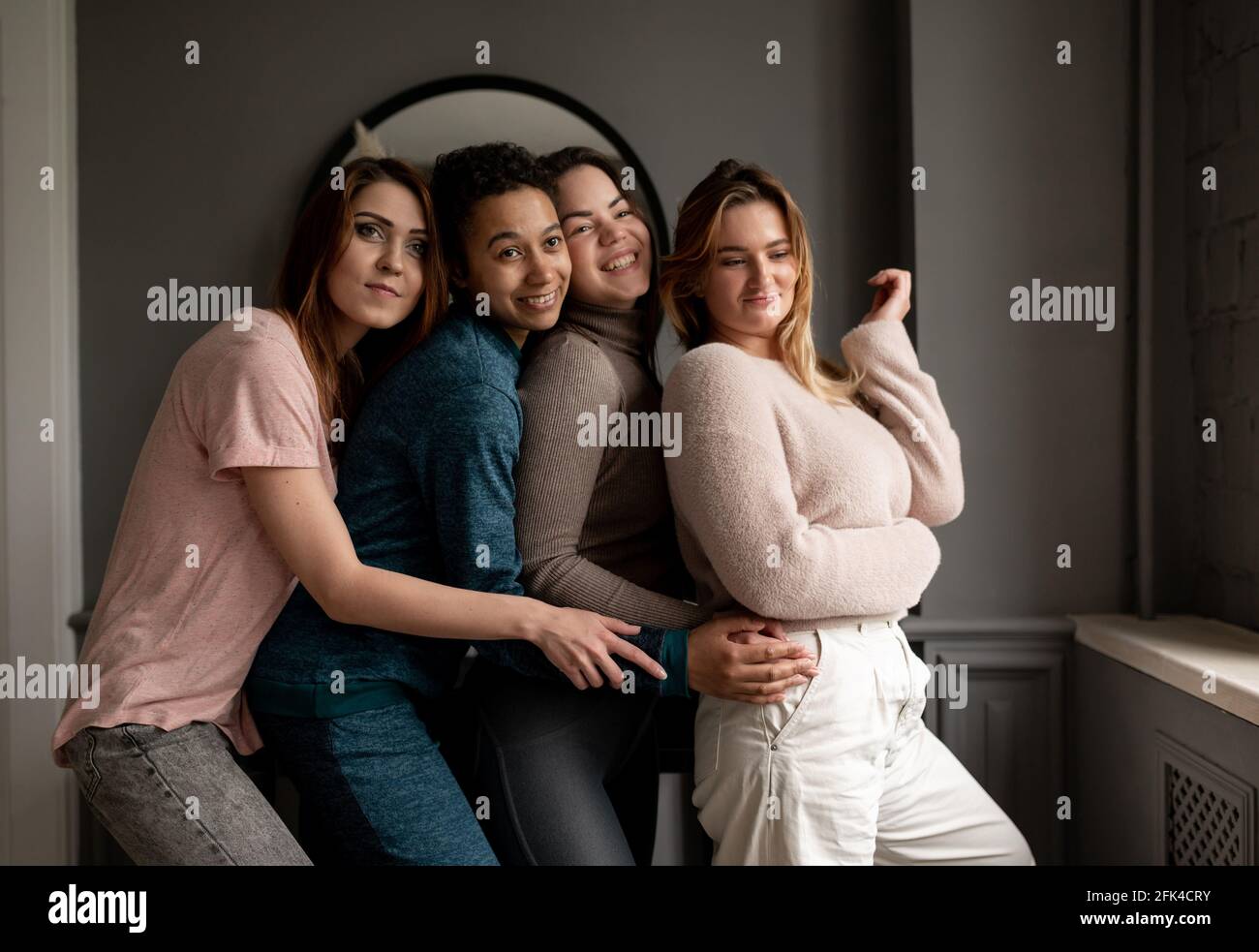 Group of young female friends hanging out at home. friendship, beauty ...