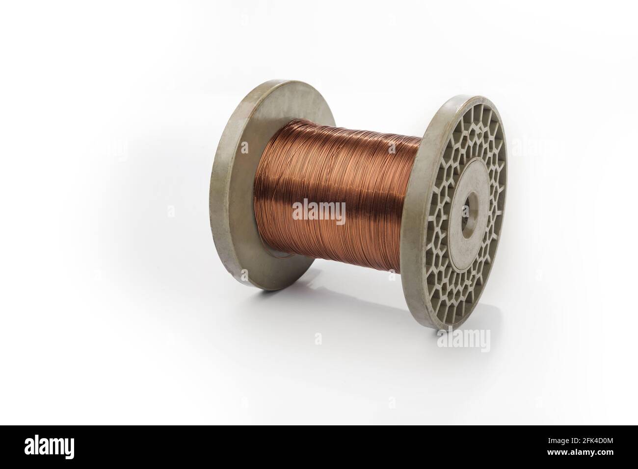 Copper wire on a reel on a white background Stock Photo - Alamy