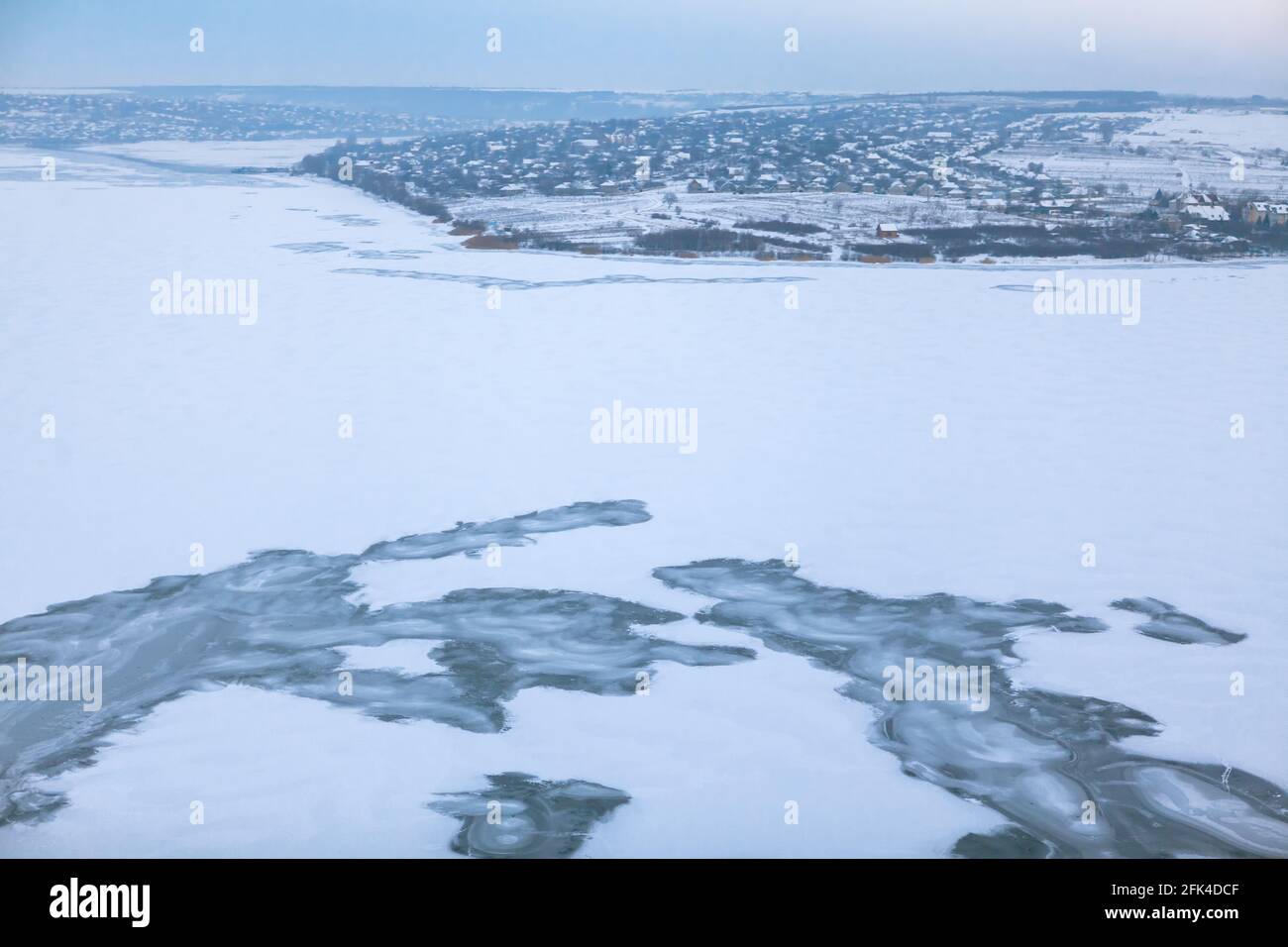 Landscape of frozen lake . Winter panorama with coastal village Stock ...