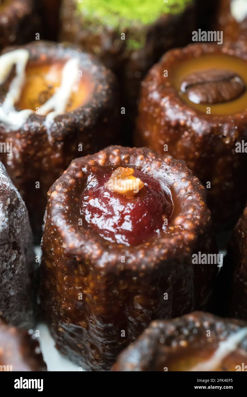 Caneles de bordeaux is a small pastry with rum and vanilla, traditional ...