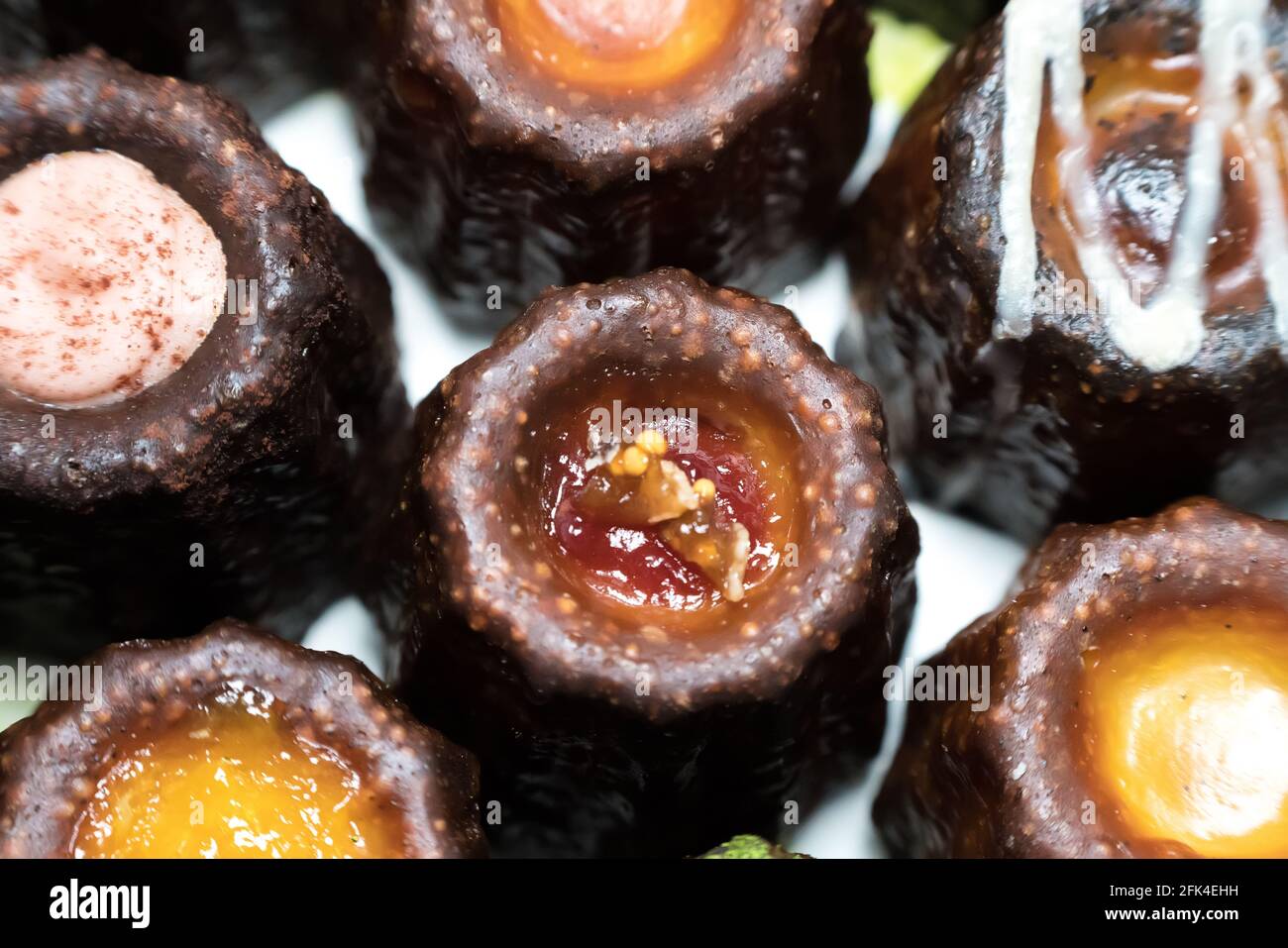 Caneles de bordeaux is a small pastry with rum and vanilla, traditional ...