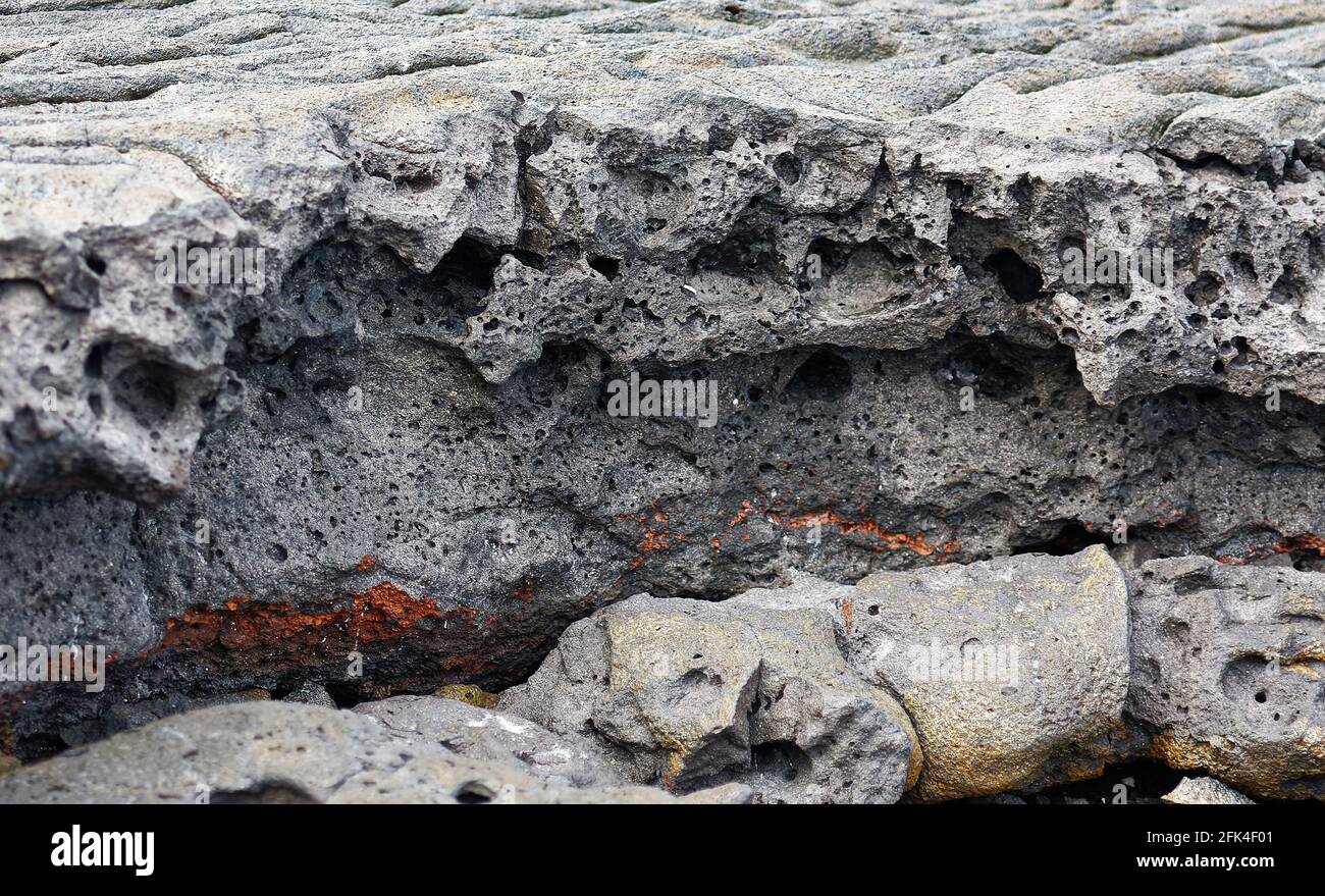 lava layers ; fissure, cutaway view, small colorful mineral deposits ...