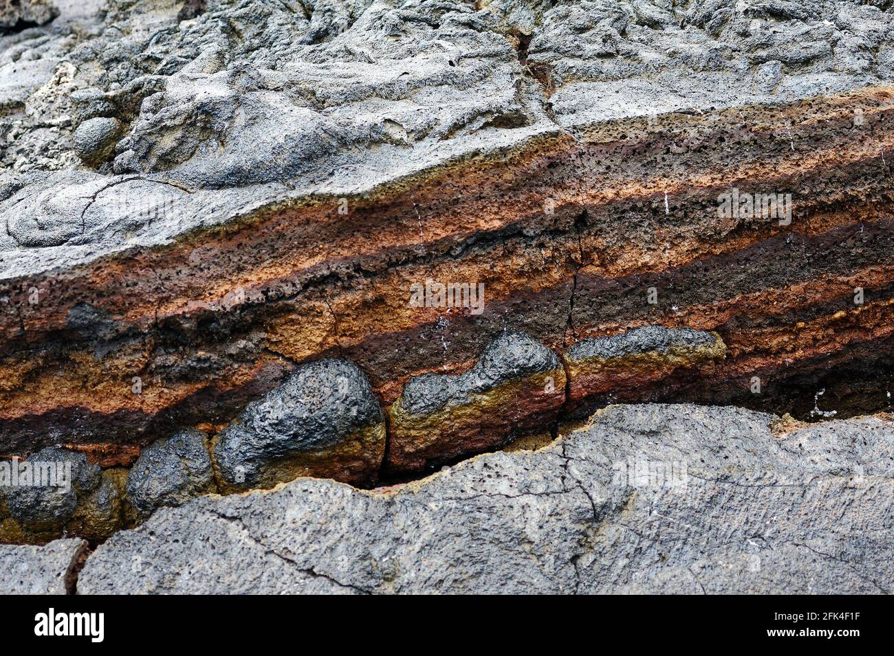 colorful lava under grey crust, minerals, volcanic activity, nature ...