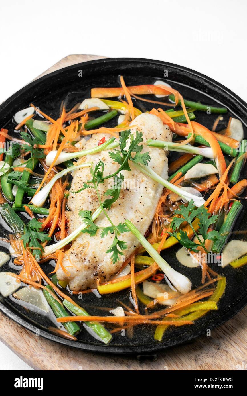 chinese cantonese style steamed spicy fish fillet with vegetables on ...
