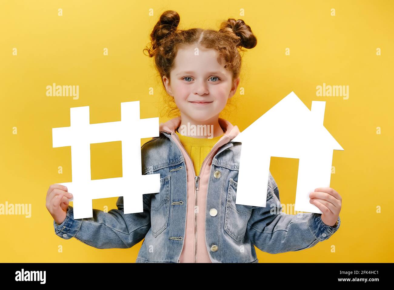Smiling cute sweet caucasian little girl child holding big paper white ...