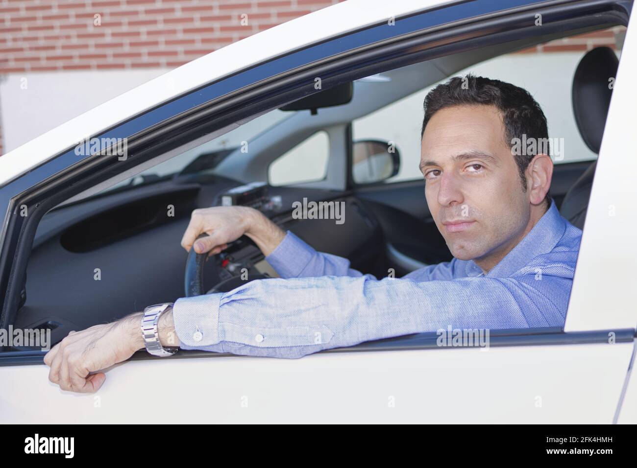Caucasian male cab driver waiting for the customer inside the cab Stock ...