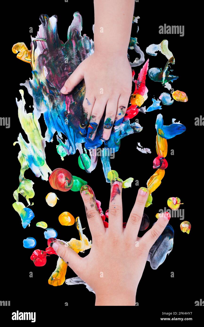 Closeup of little children hands doing finger painting with various ...