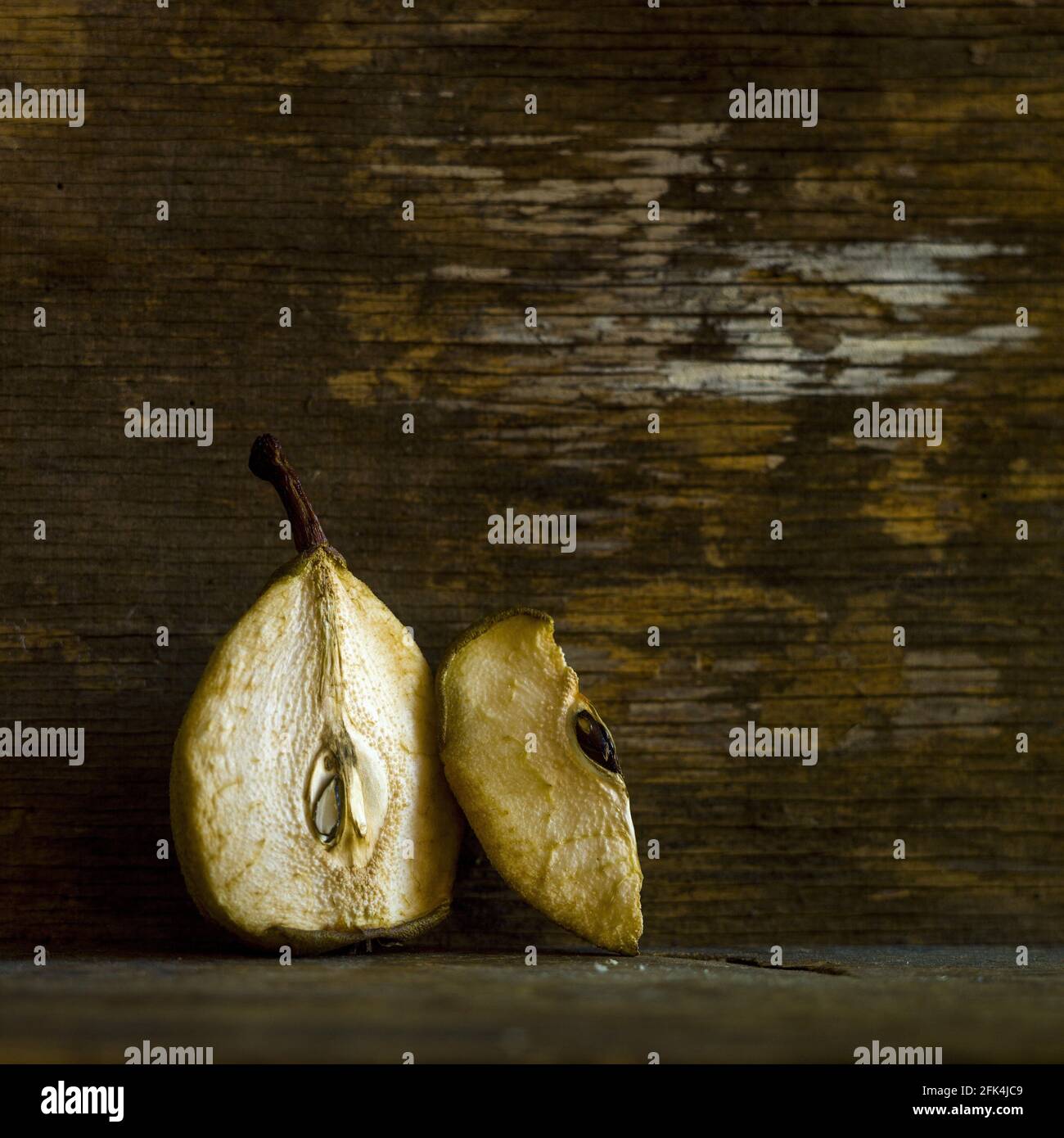 Closeup shot of cut pears isolated on a brown background Stock Photo ...