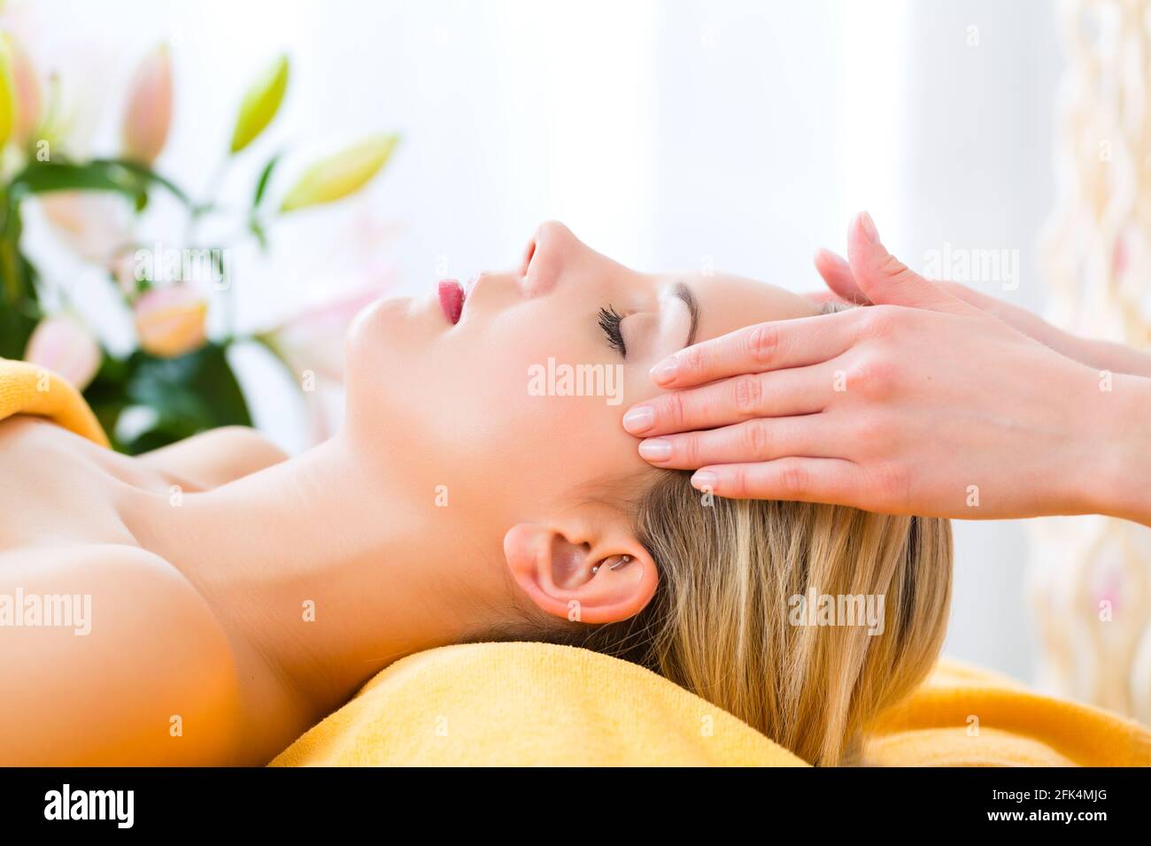 Wellness - woman receiving head or face massage in spa Stock Photo - Alamy