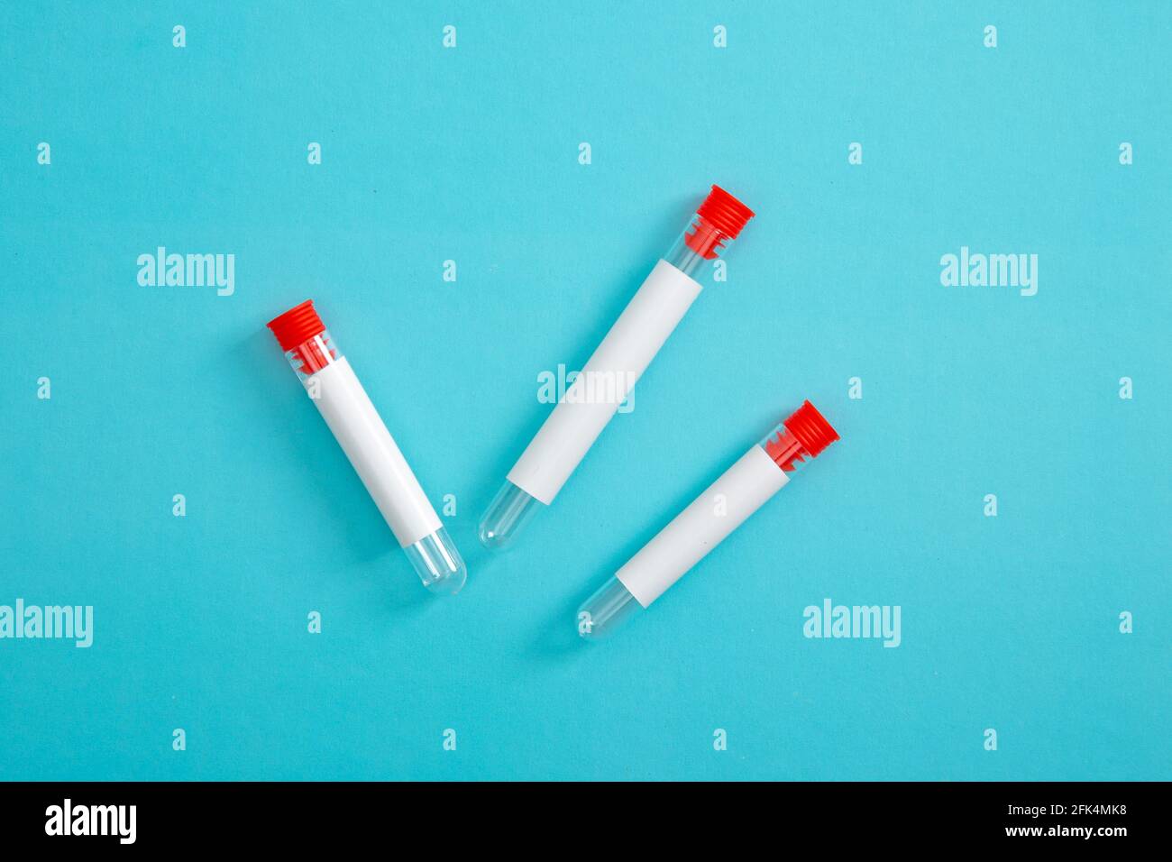 Test tubee on blue background, Top view Stock Photo - Alamy