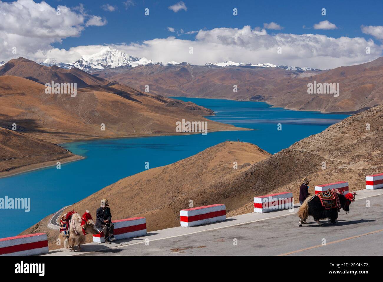 The bright blue glacial waters of Yamdrok Lake and the Gampa High Pass ...