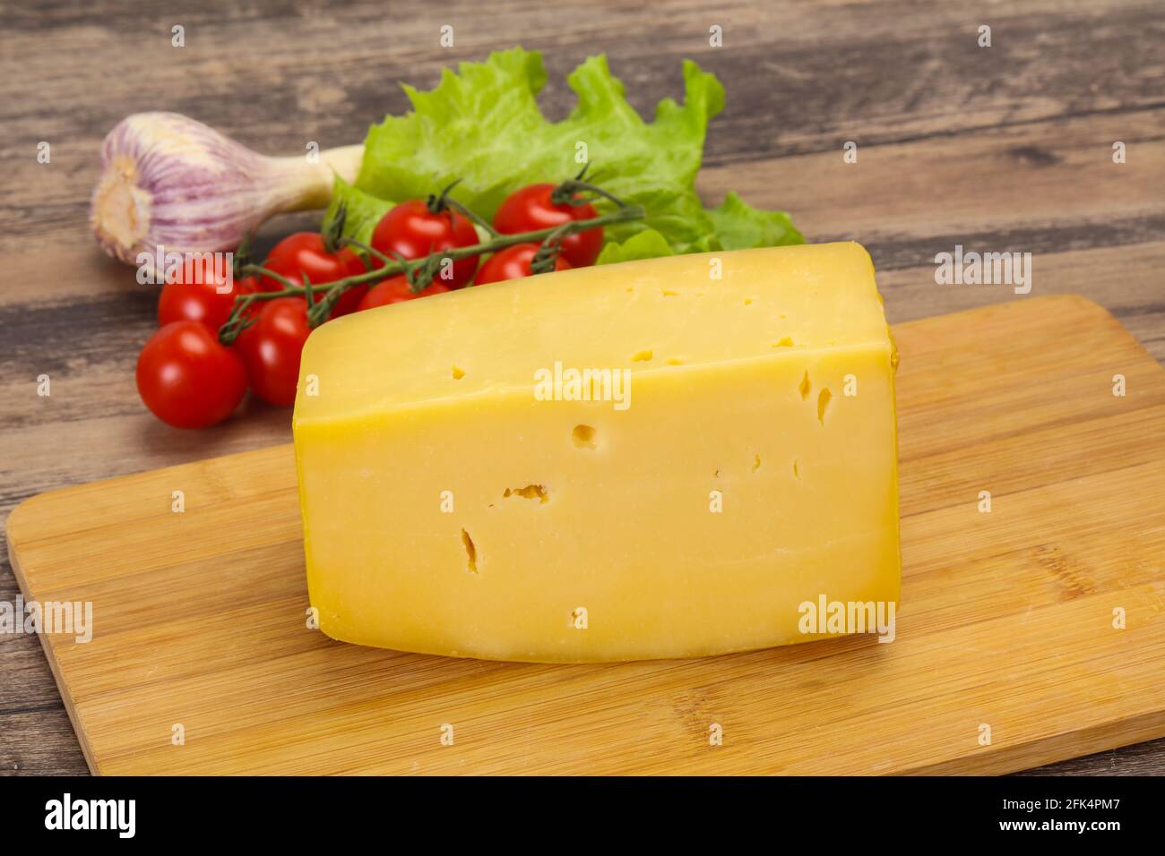 Swiss Hard yellow tasty cheese brick Stock Photo - Alamy