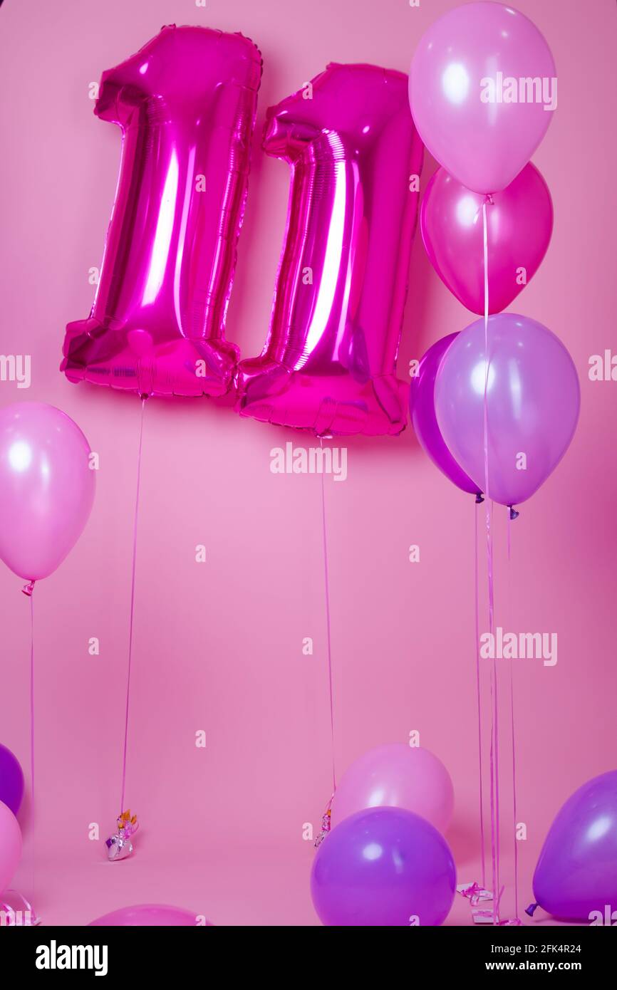colorful blue, pink and purple balloons near air balloons shaped number ...