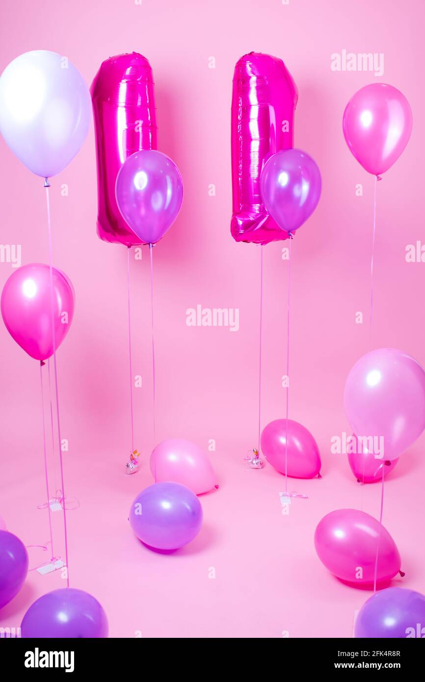 colorful blue, pink and purple balloons near air balloons shaped number ...