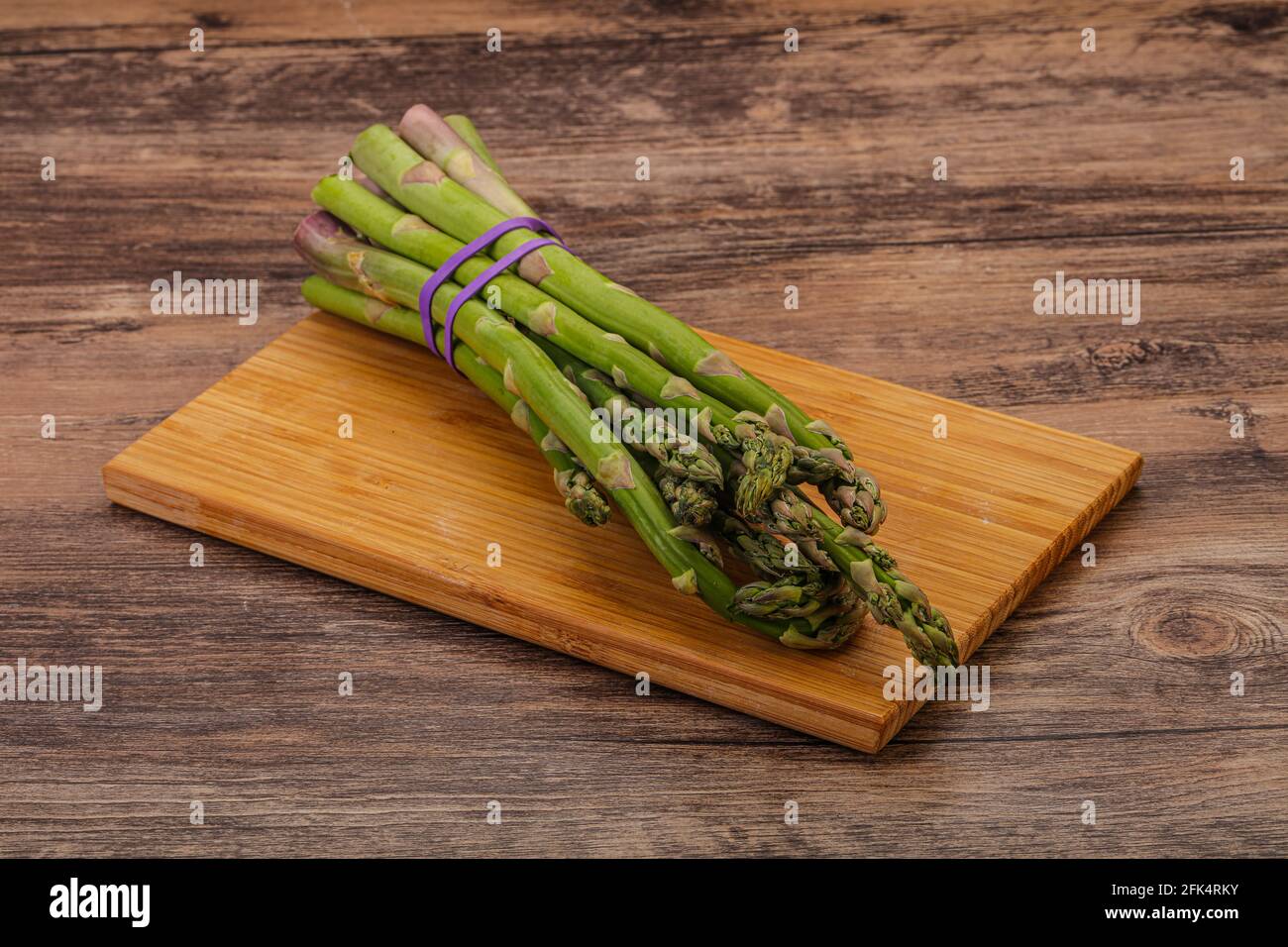 Vegan cuisine - Raw asparagus heap for cooking Stock Photo - Alamy