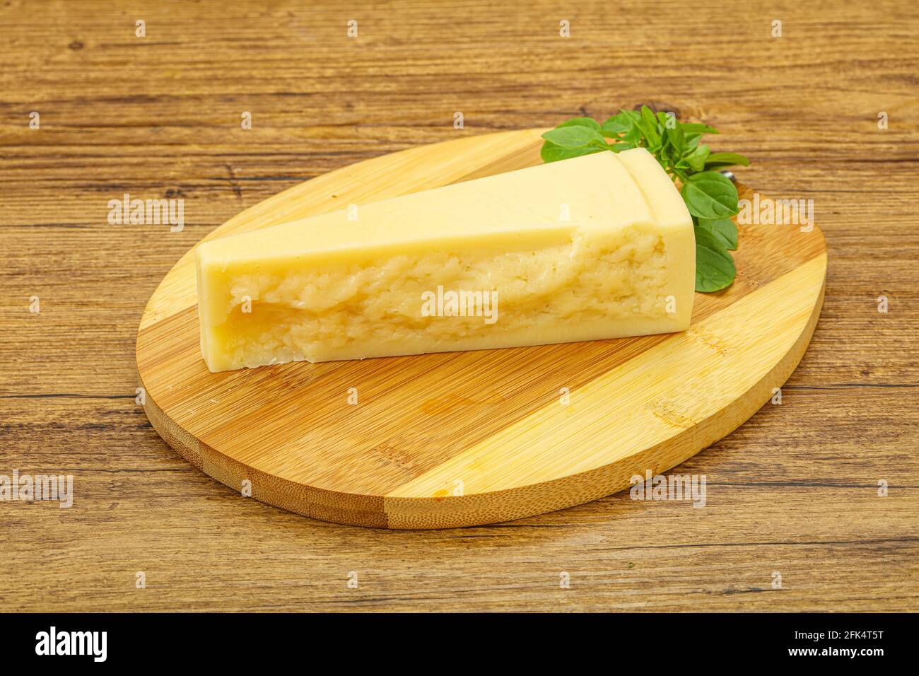 Hard parmesan cheese served basil leaves Stock Photo - Alamy
