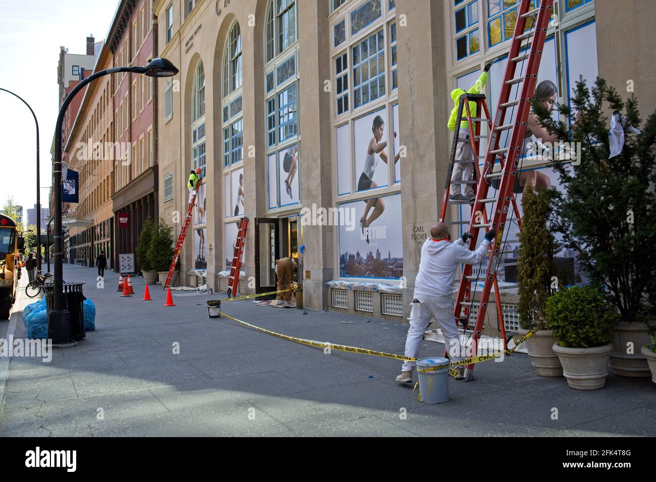 New York, NY, USA - Apr 28, 2021: Workers putting the finishing touches ...