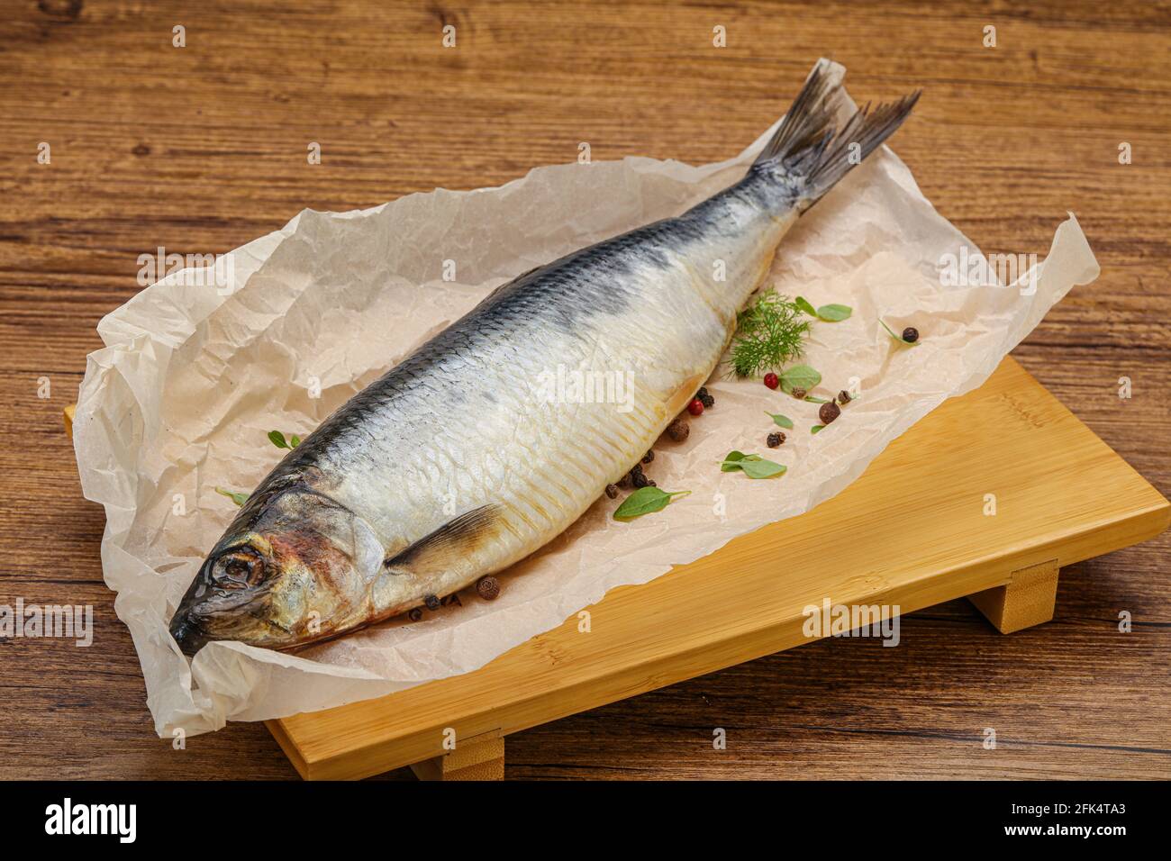 Salted Herring fish with pepper and spices Stock Photo - Alamy
