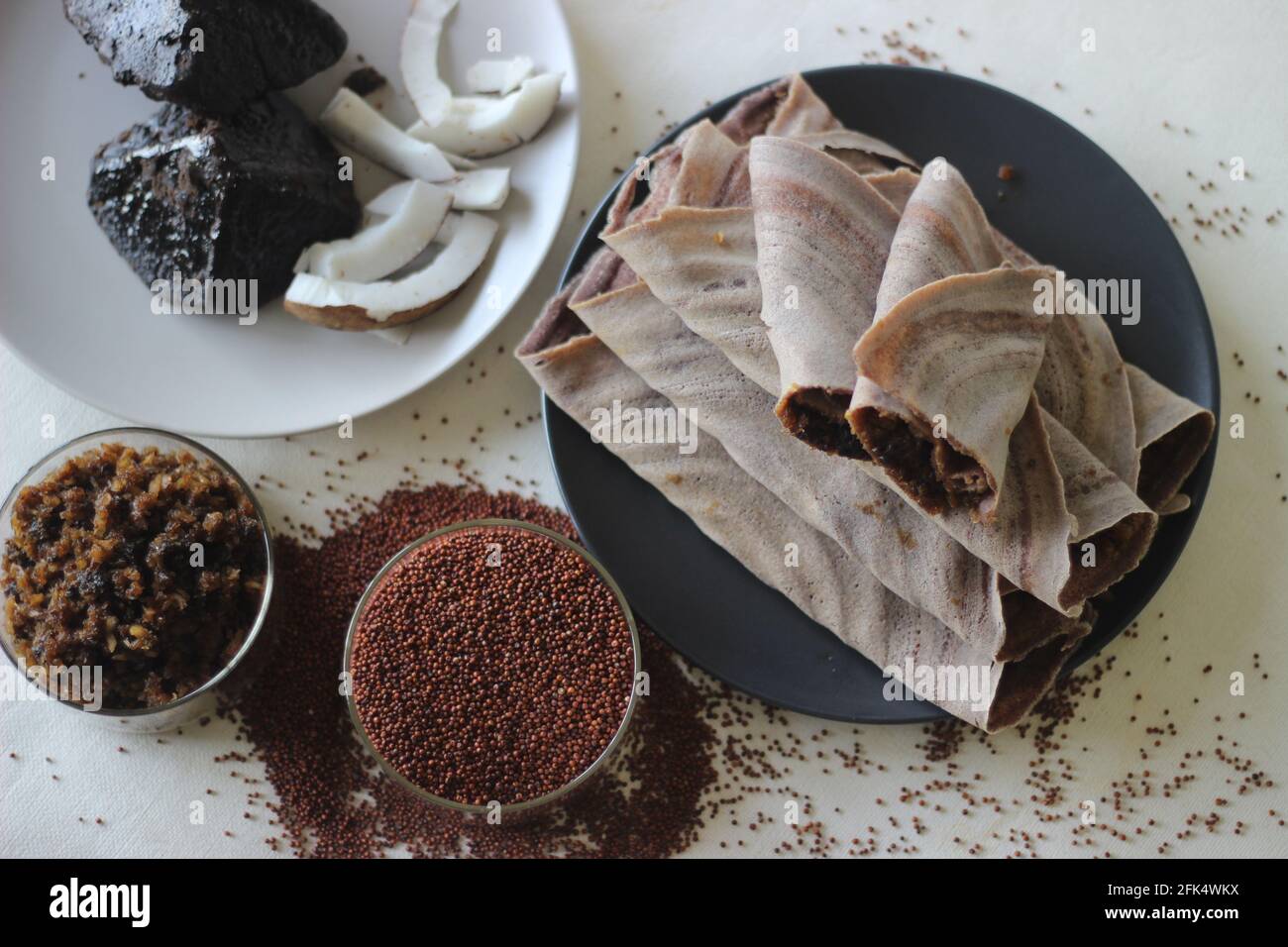 Finger millet crepes with freshly grated coconut and palm jaggery ...