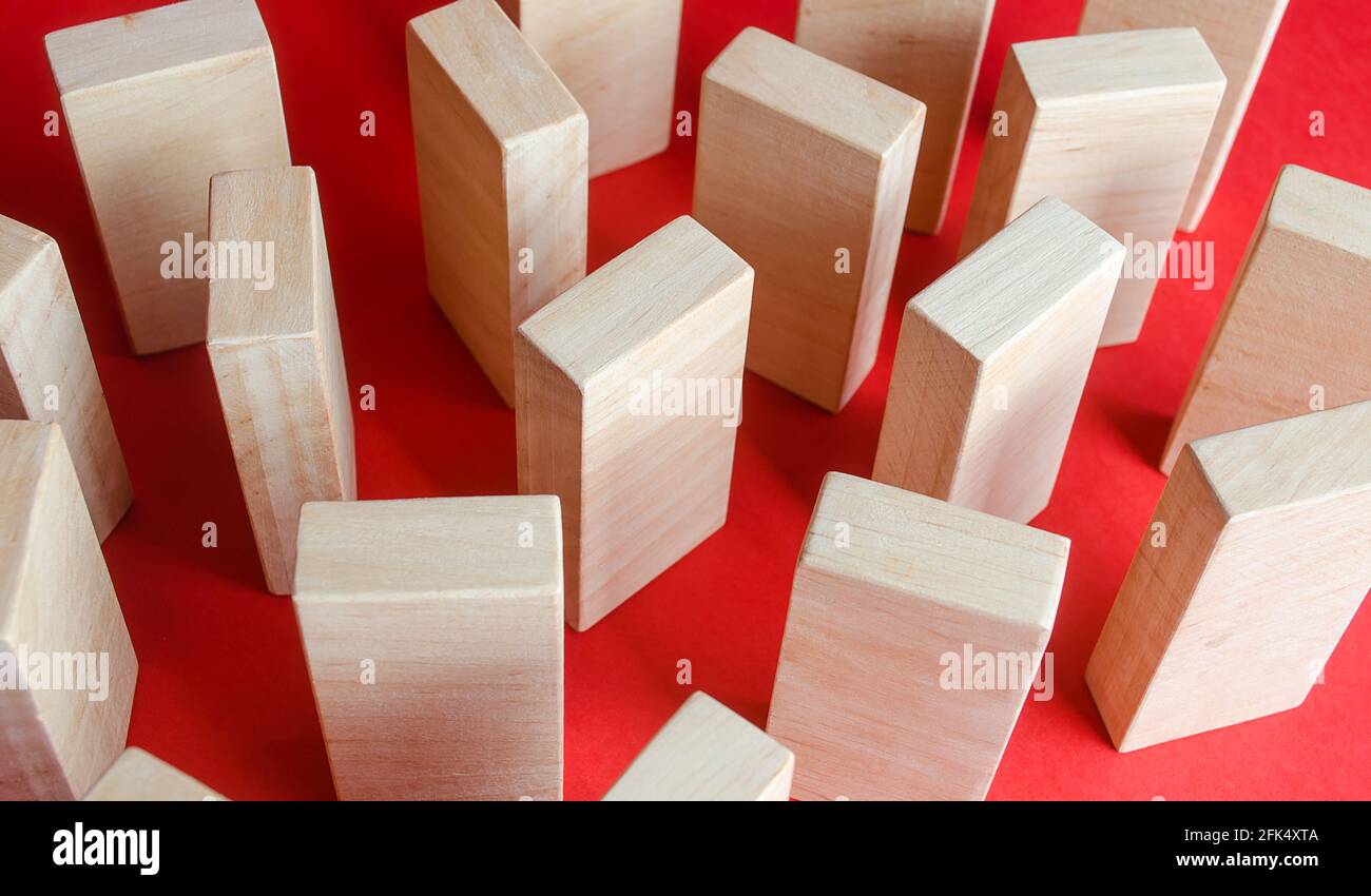 Wooden blocks on a red background. The concept of a labyrinth of ...