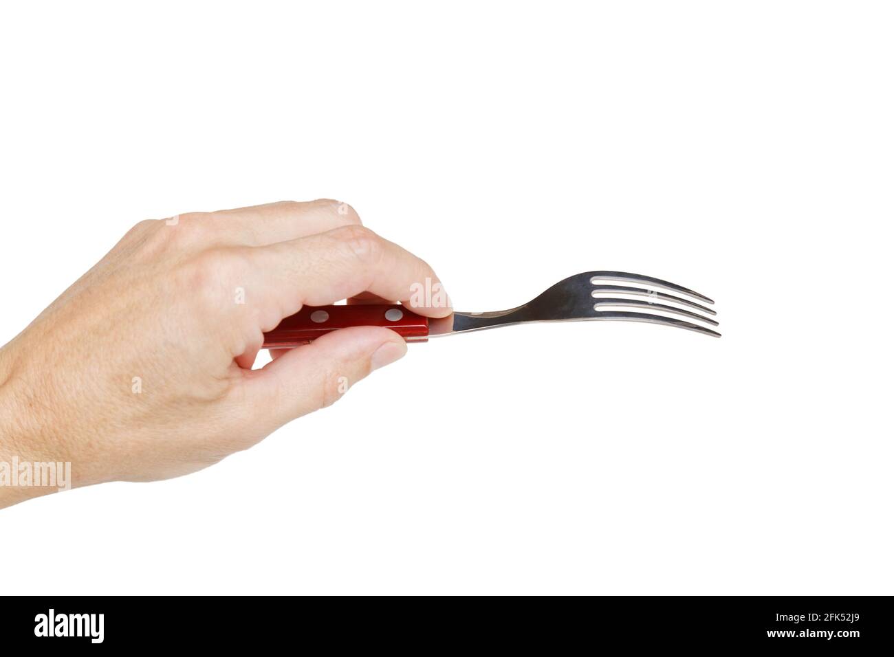 Humans left hand holding a silver fork isolated on white. Concept Stock ...