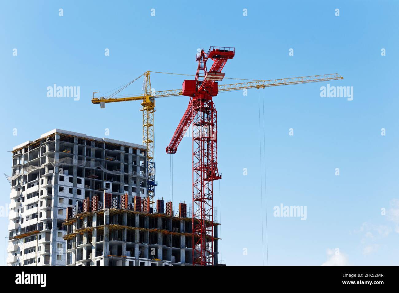 High-rise buildings under construction with red and yellow building ...